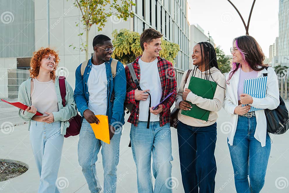 Group of Diverse Students Joyfully Walking and Talking Together while ...