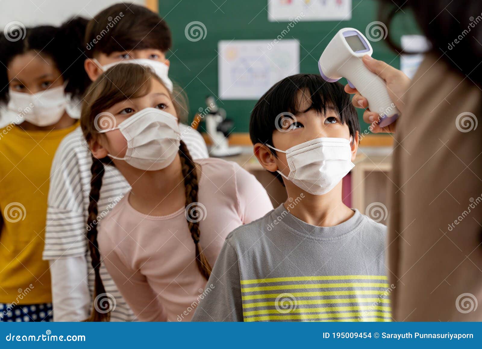 Group of Diverse Students in School Building Checked and Scanned for ...