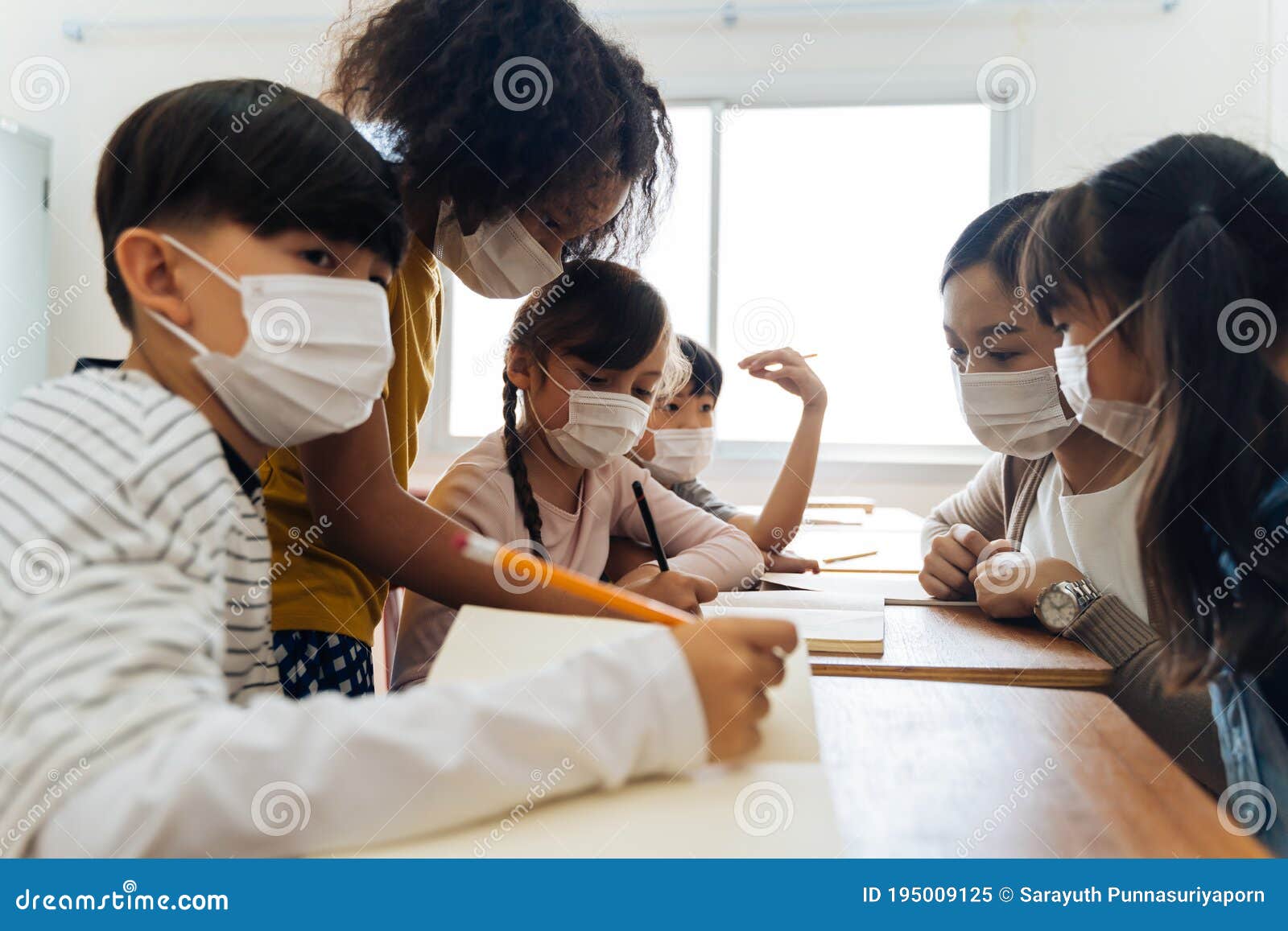 Group of Diverse Students in School Building Discussing in Group Study ...