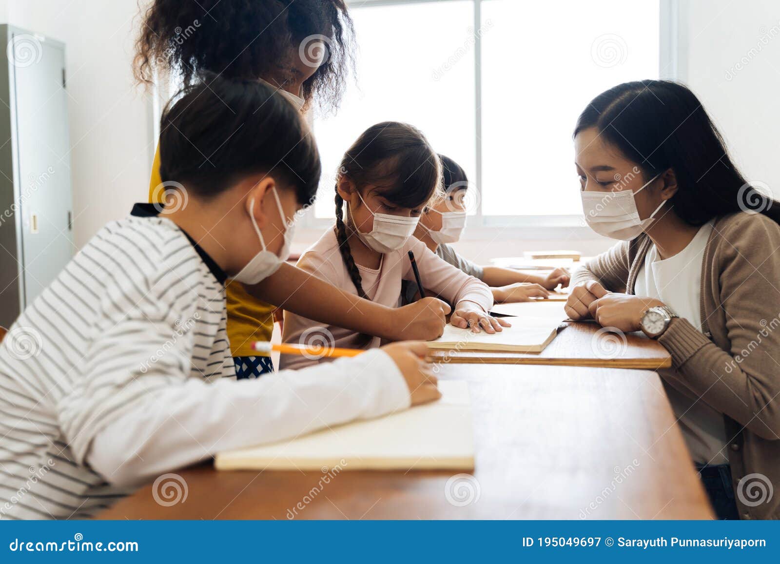 Group of Diverse Students in School Building Discussing in Group Study ...
