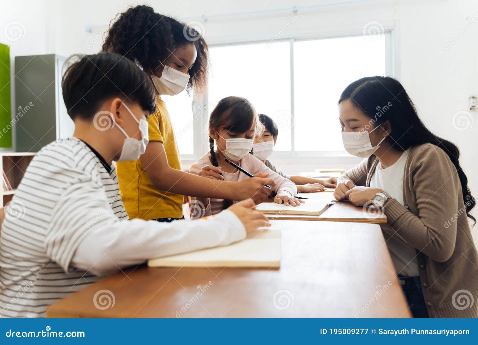 Class Of Elementary School Pupils Answering Question Royalty-Free Stock ...