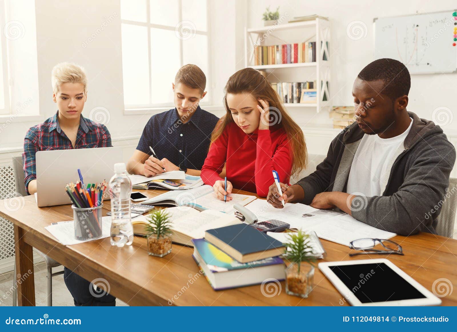 Group of Diverse Students Studying at Wooden Table Stock Photo - Image ...