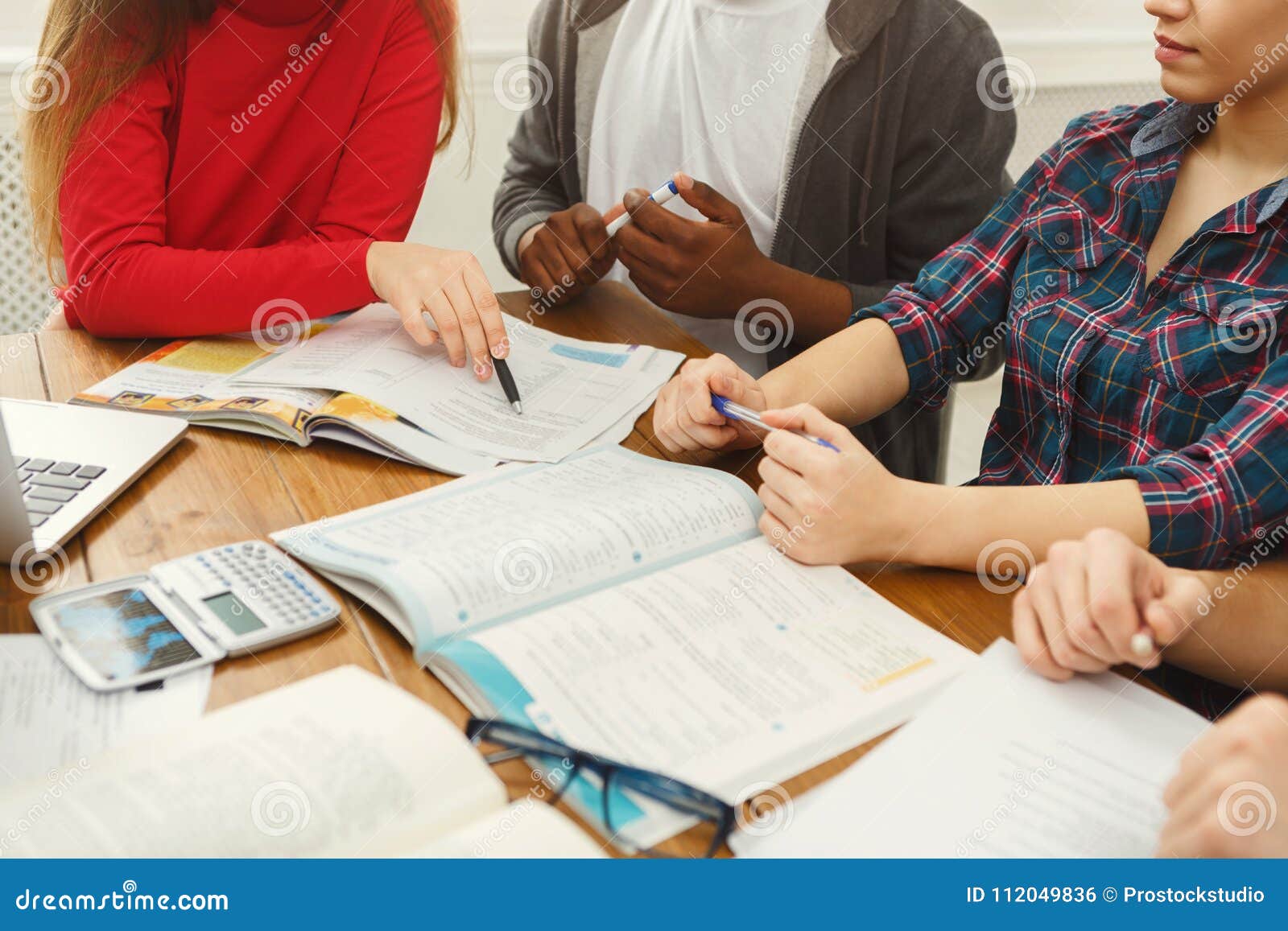 Group of Diverse Students Studying at Wooden Table Stock Photo - Image ...