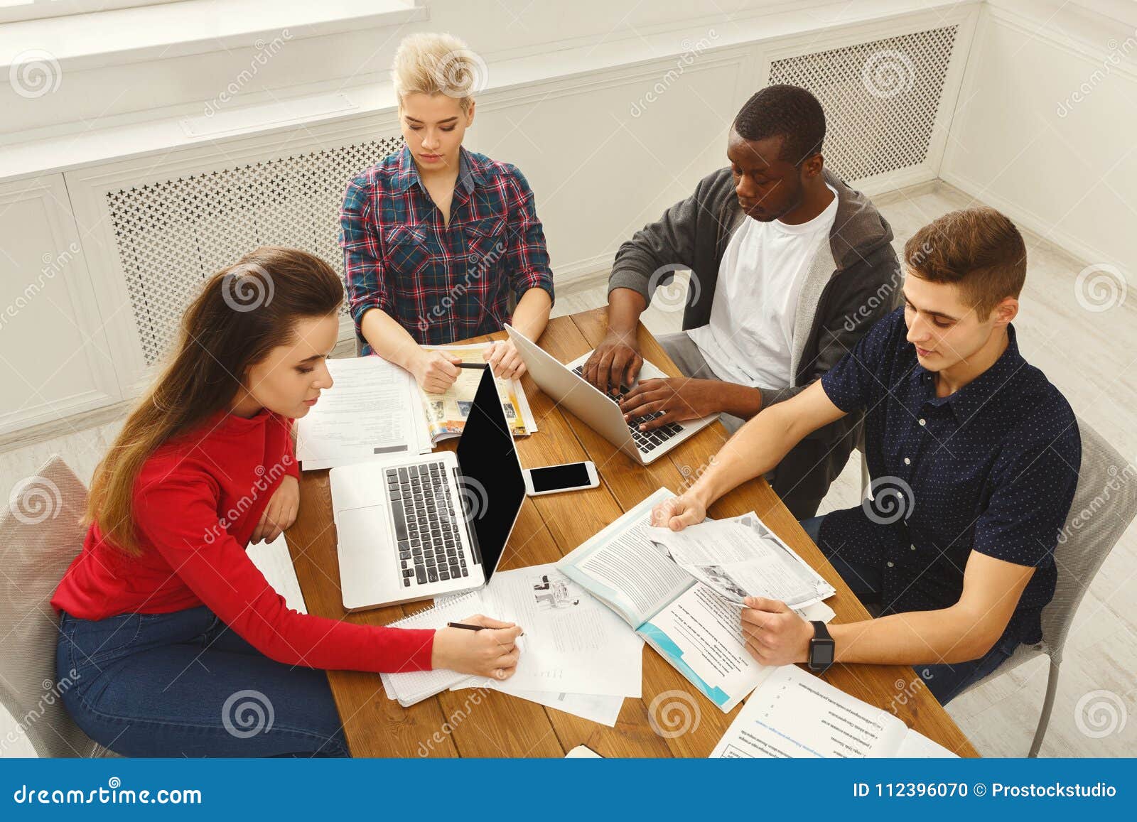 Group of Diverse Students Studying at Wooden Table Stock Photo - Image ...