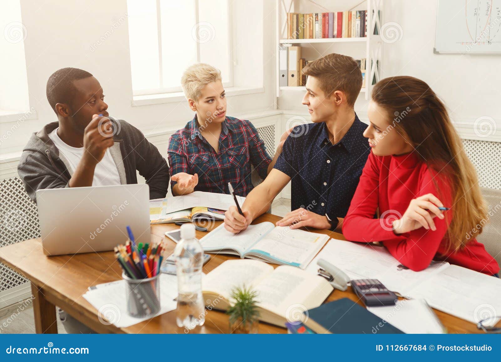 Group of Diverse Students Studying at Wooden Table Stock Photo - Image ...
