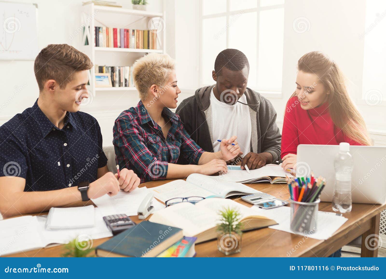 Group of Diverse Students Studying at Wooden Table Stock Photo - Image ...