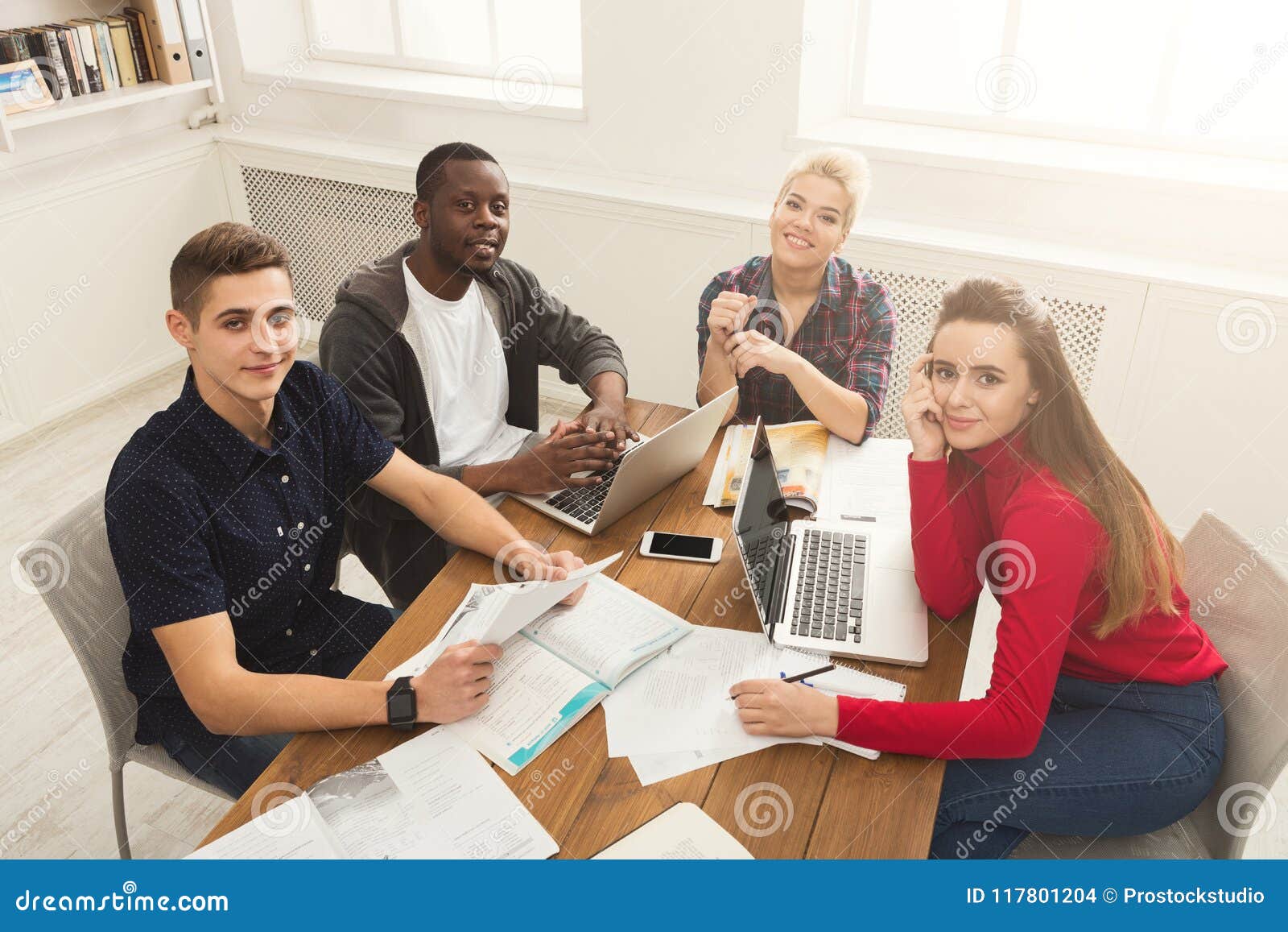 Group of Diverse Students Studying at Wooden Table Stock Photo - Image ...