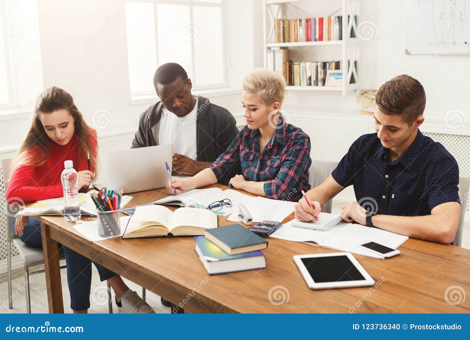 Group of Diverse Students Studying at Wooden Table Stock Photo - Image ...