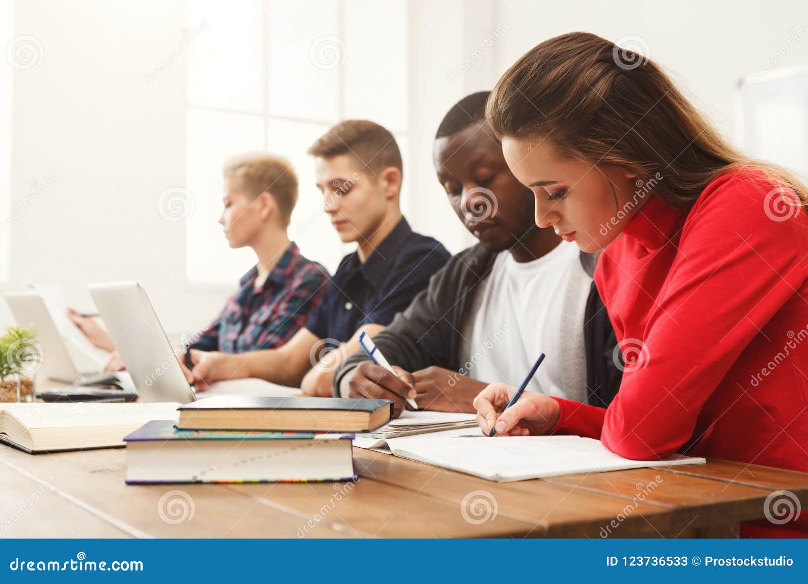 Group of Diverse Students Studying at Wooden Table Stock Image - Image ...