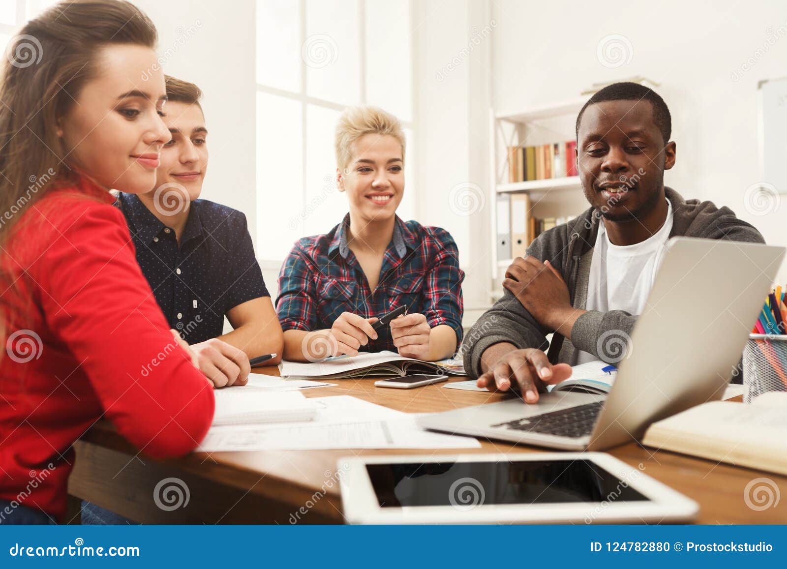Group of Diverse Students Studying at Wooden Table Stock Photo - Image ...