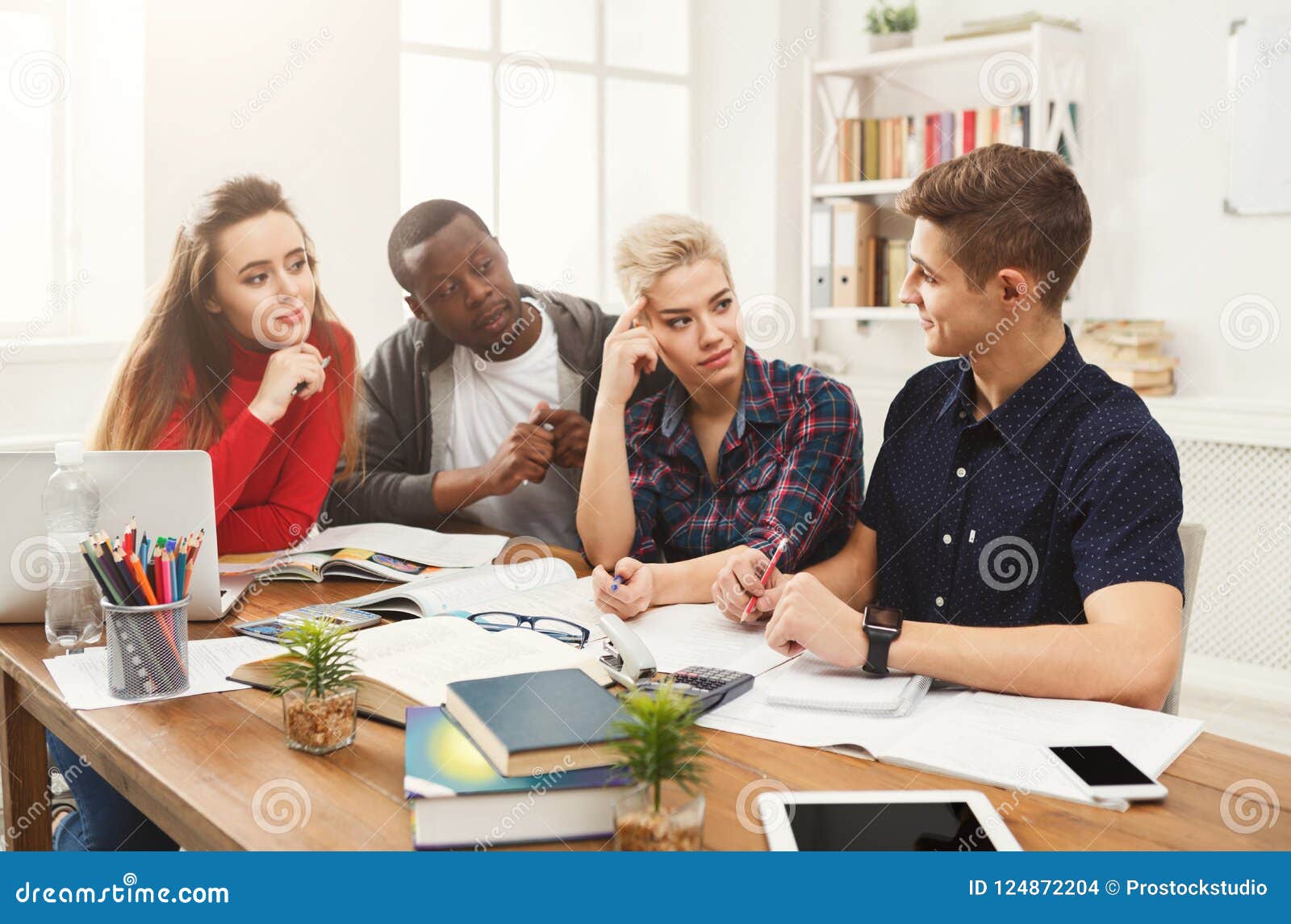Group of Diverse Students Studying at Wooden Table Stock Photo - Image ...