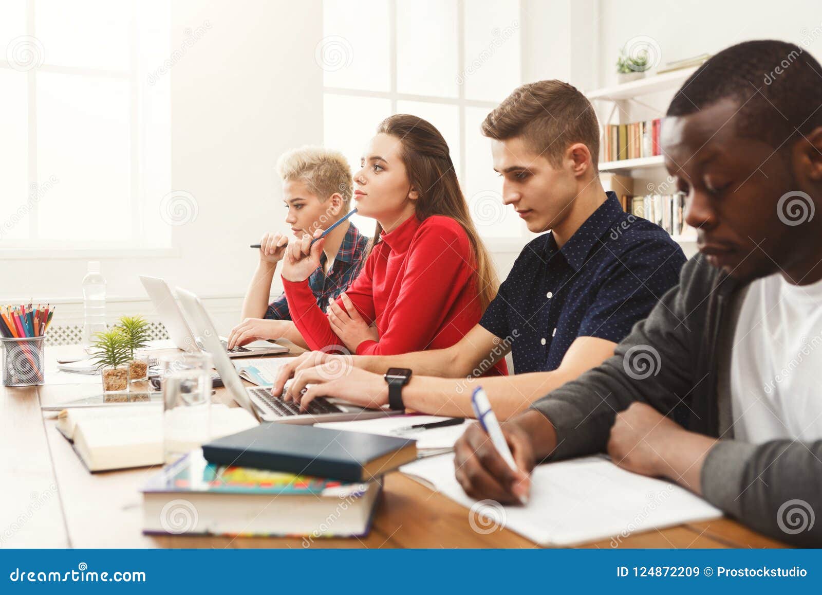 Group of Diverse Students Studying at Wooden Table Stock Image - Image ...