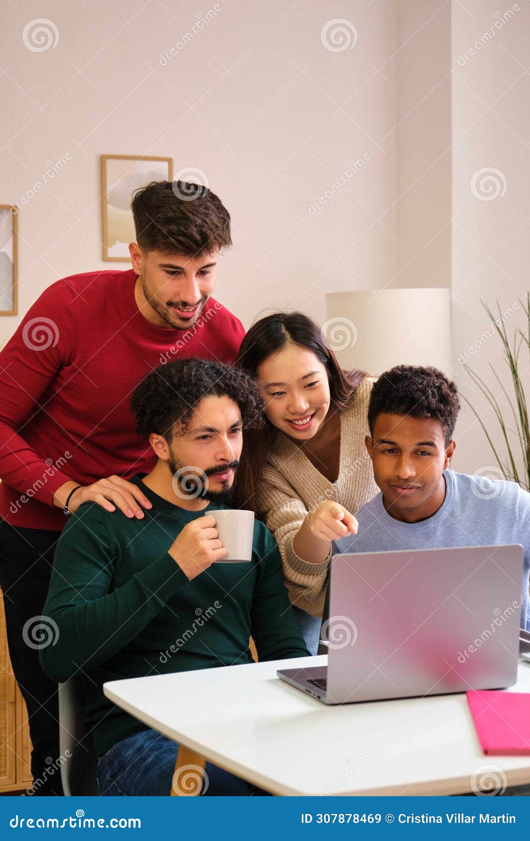 Group of Diverse University Colleagues Studying Together with a Laptop ...