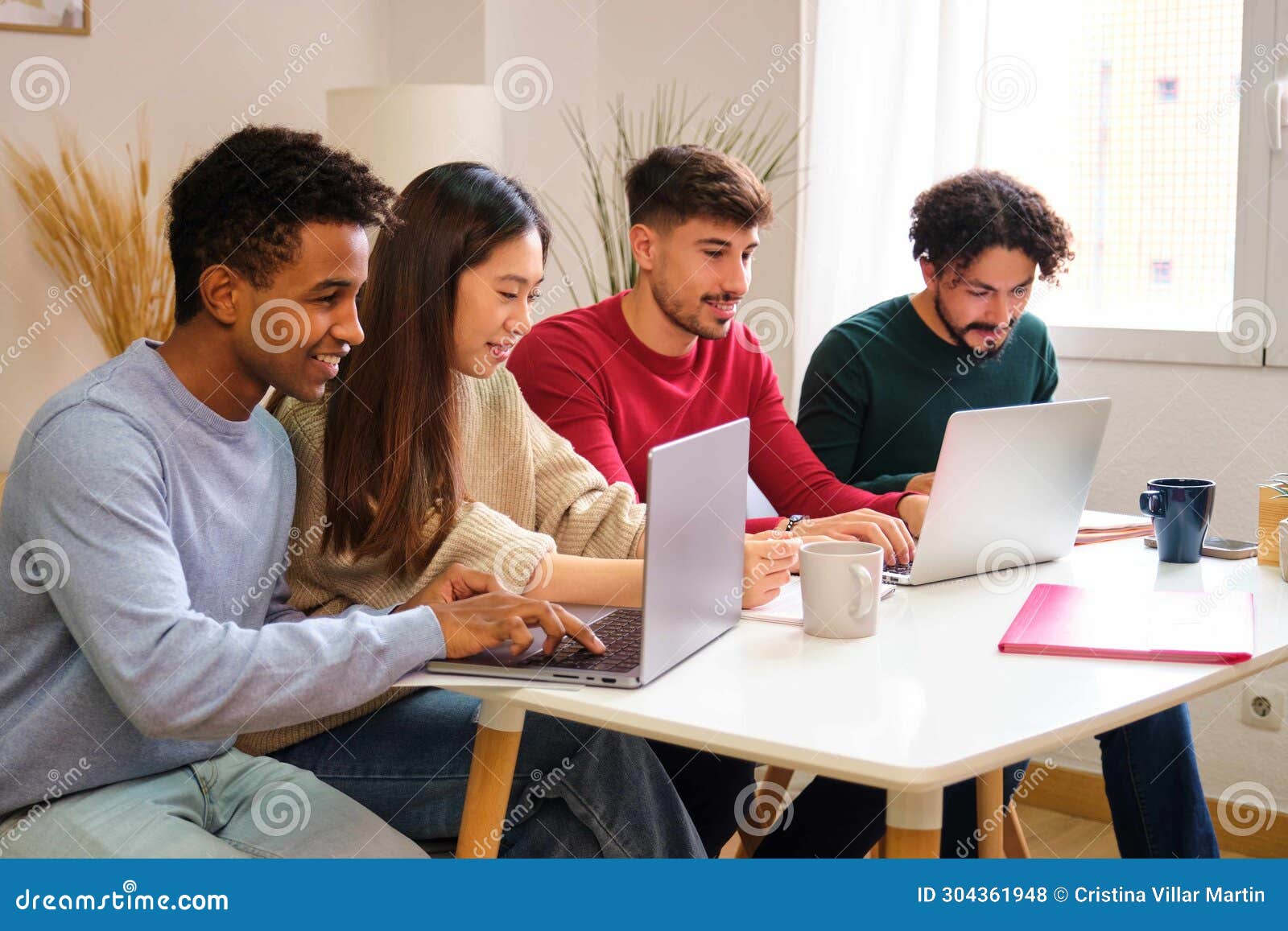 Group of Diverse University Colleagues Studying Together at Shared Flat ...