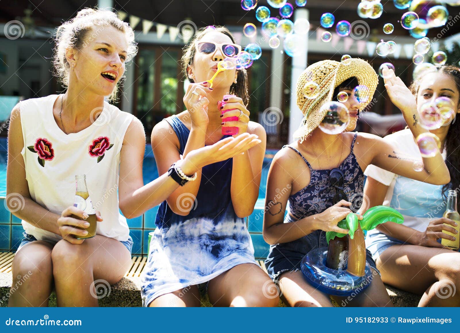 Group of Diverse Women Sitting by the Pool Blow Soap Bubble Stock Image ...