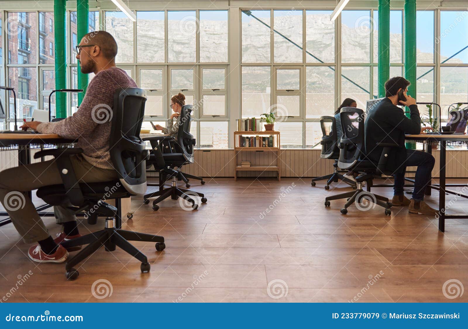 Group of Diverse Young Businesspeople Working at Their Desk in an ...