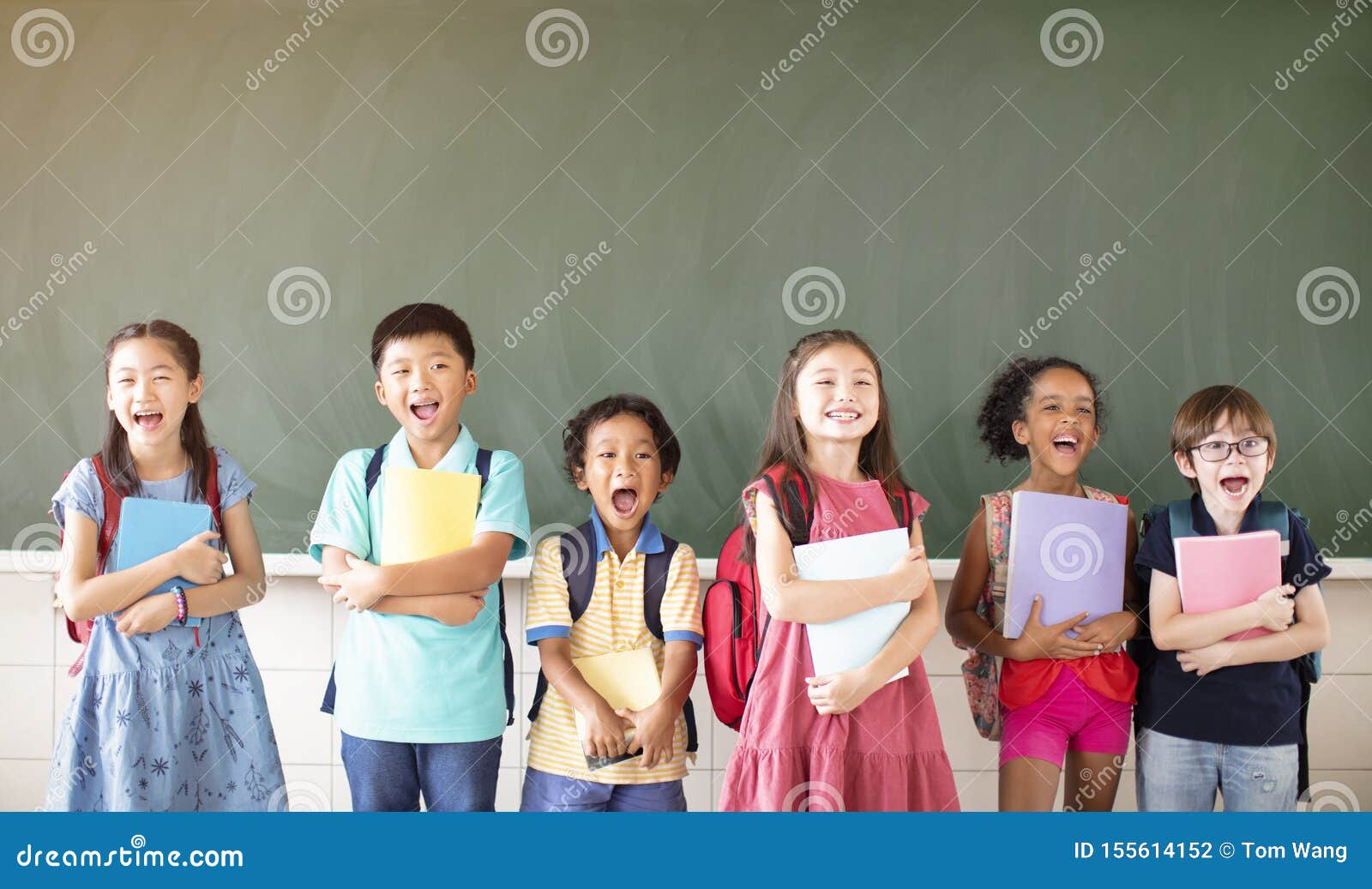 Diverse Young Students Standing Together in Classroom Stock Photo ...
