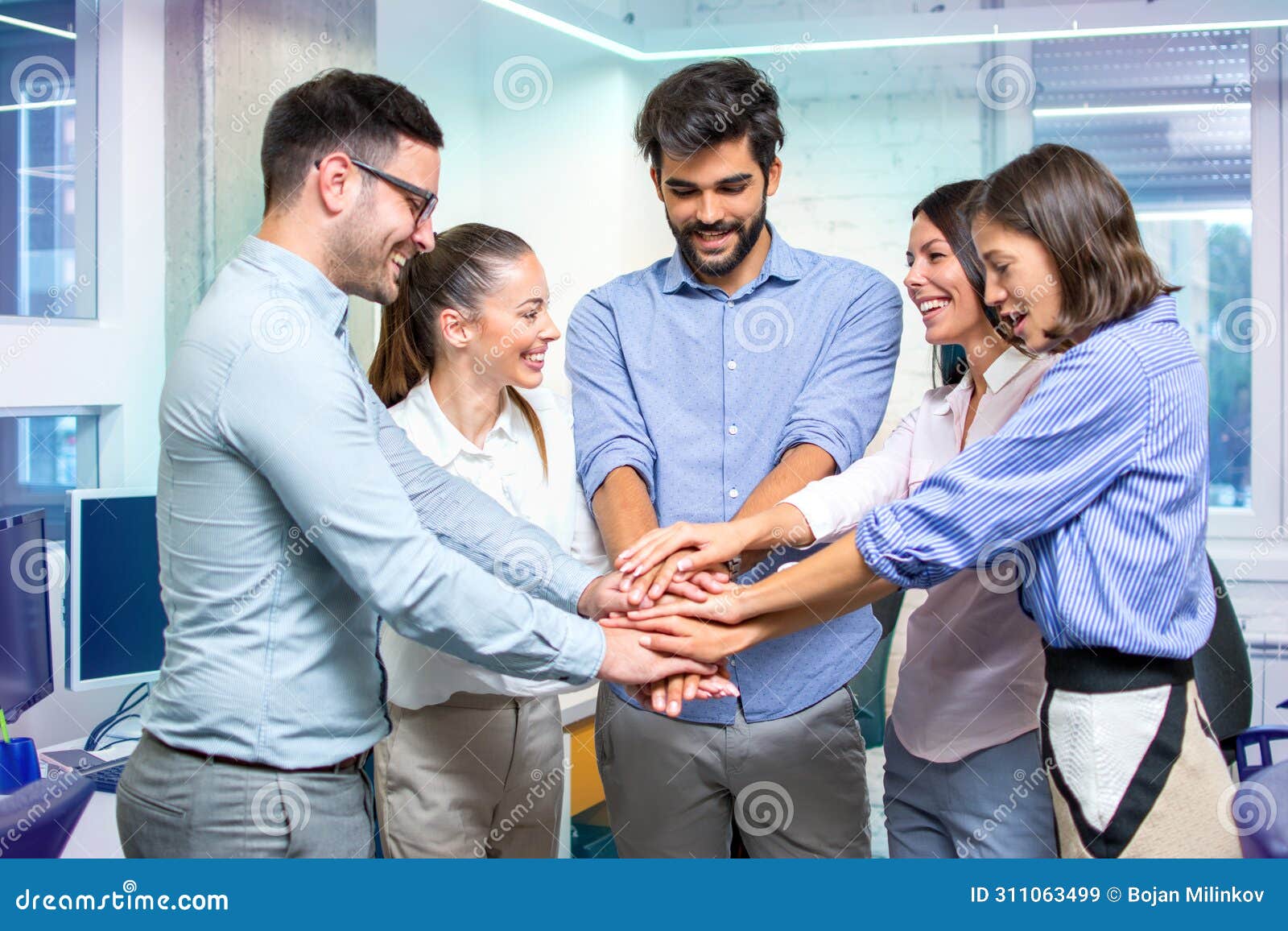 Group of Diversity Employees Stacking Hands Together Making Strong Team ...