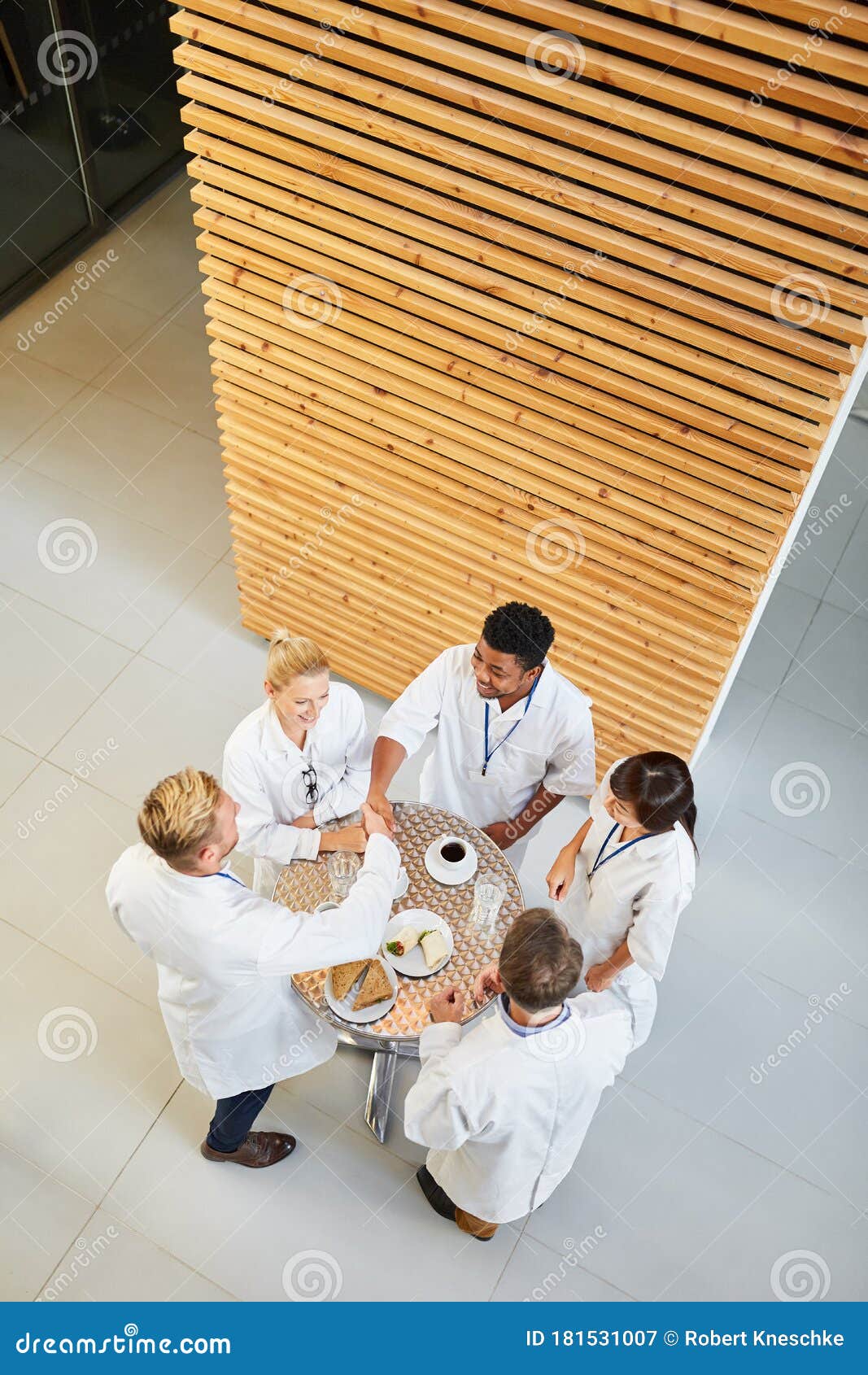 Group of Doctors in the Cafeteria in a Coffee Break Stock Image - Image ...
