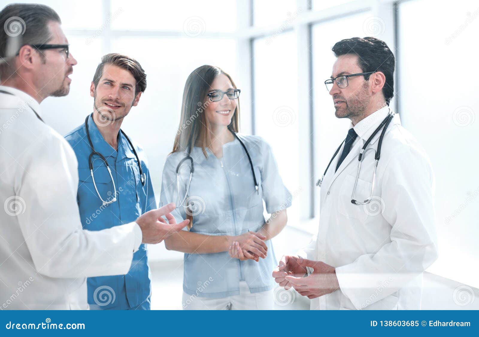 Group of Doctors Discussing Problems in the Hospital Corridor Stock ...