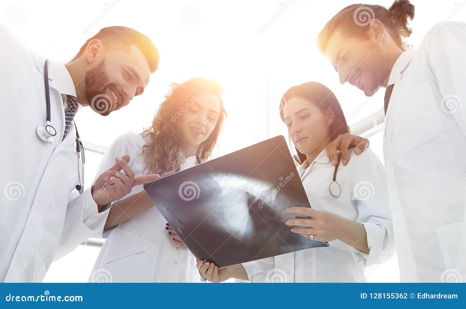 Group of Doctors Discussing an X-ray Stock Photo - Image of consultant ...
