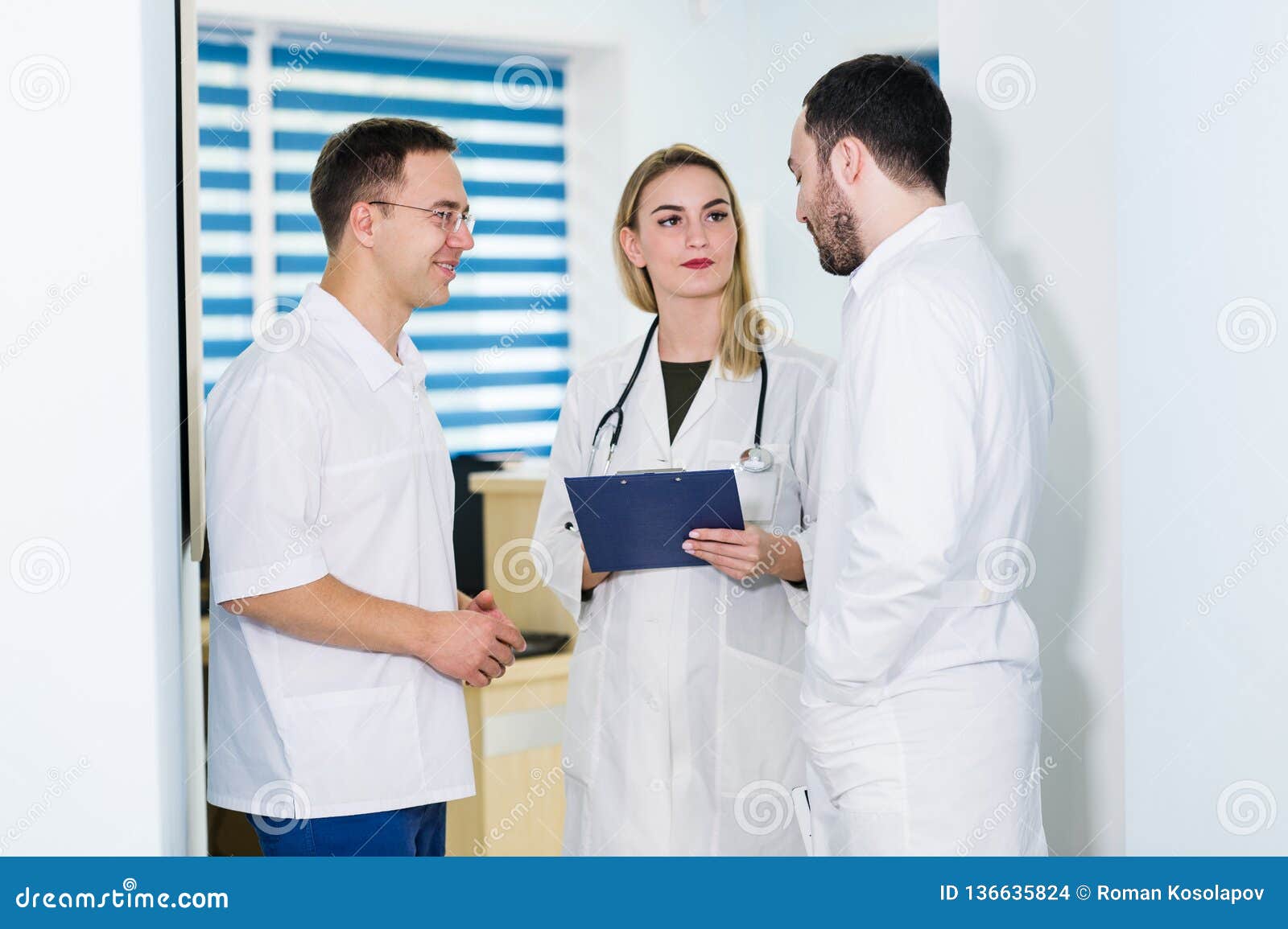 Group of Doctors Discussing and Working Together Stock Photo - Image of ...