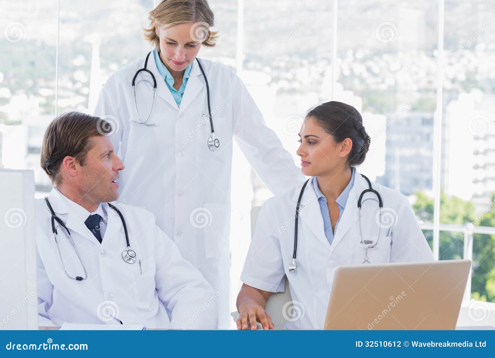 Group of Doctors Discussing and Working Together Stock Photo - Image of ...
