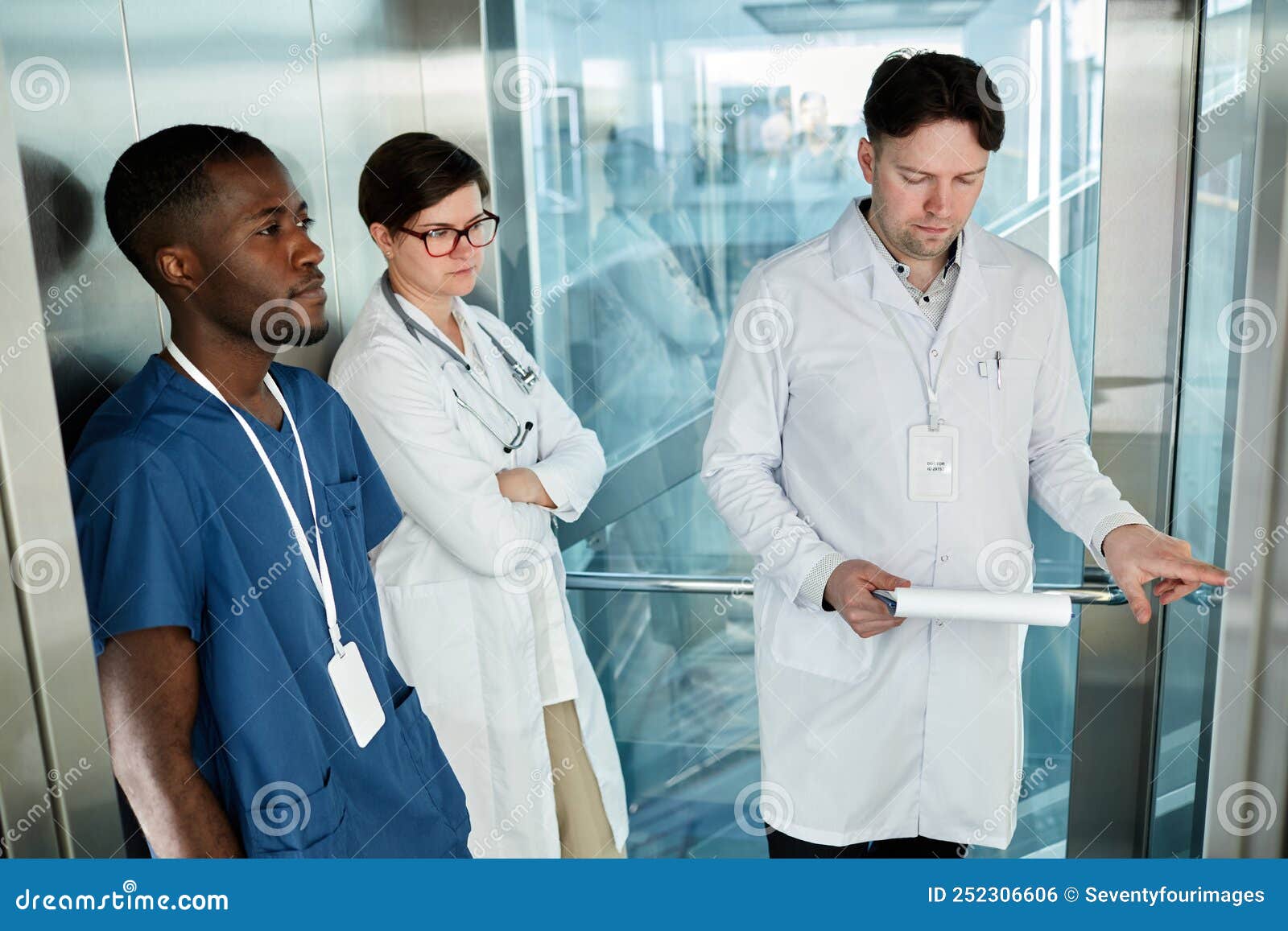 Group of Doctors in Elevator Stock Photo - Image of doctor, medicine ...
