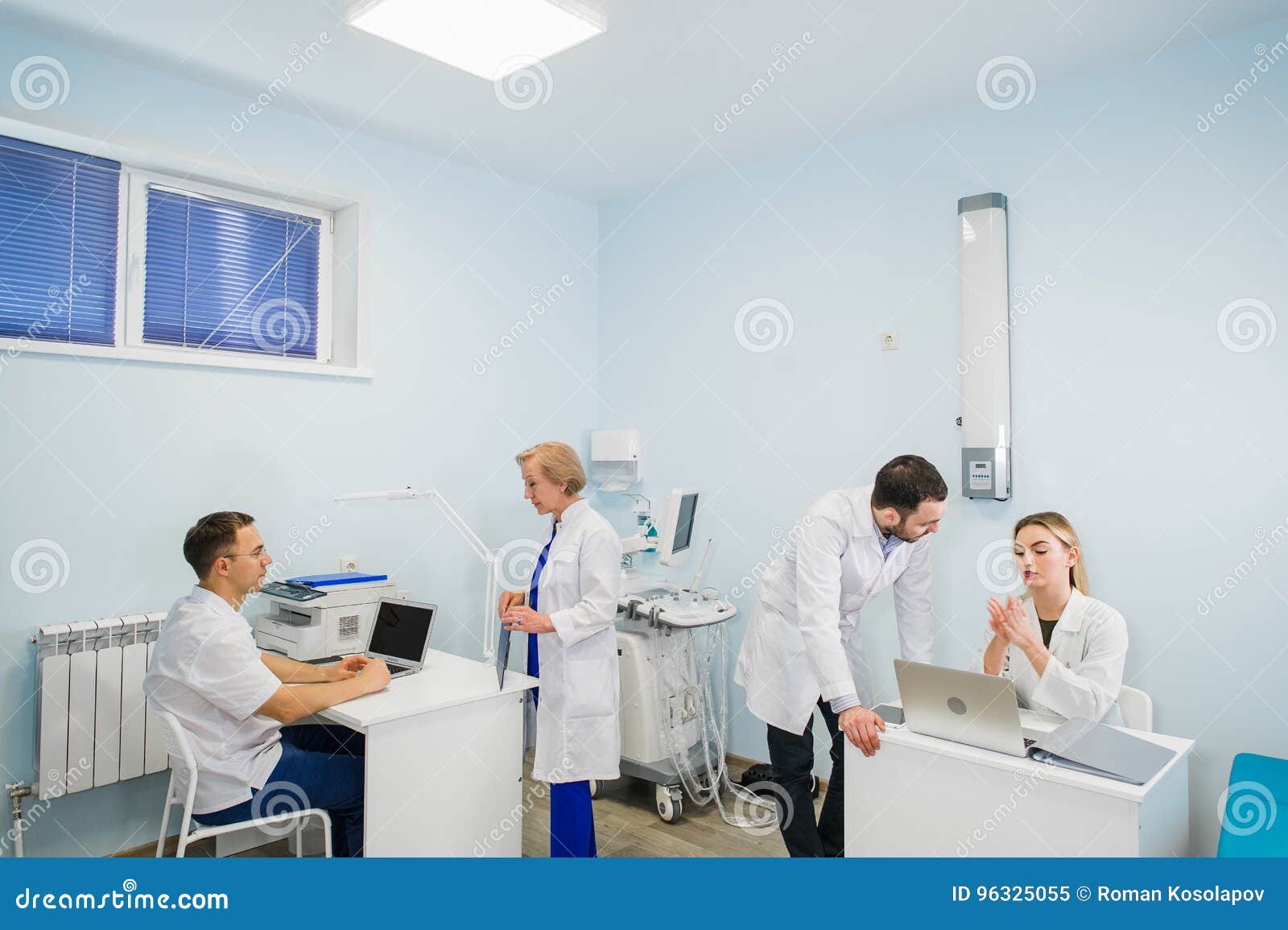 Group of Doctors Involved in Serious Discussion with Medical Records ...