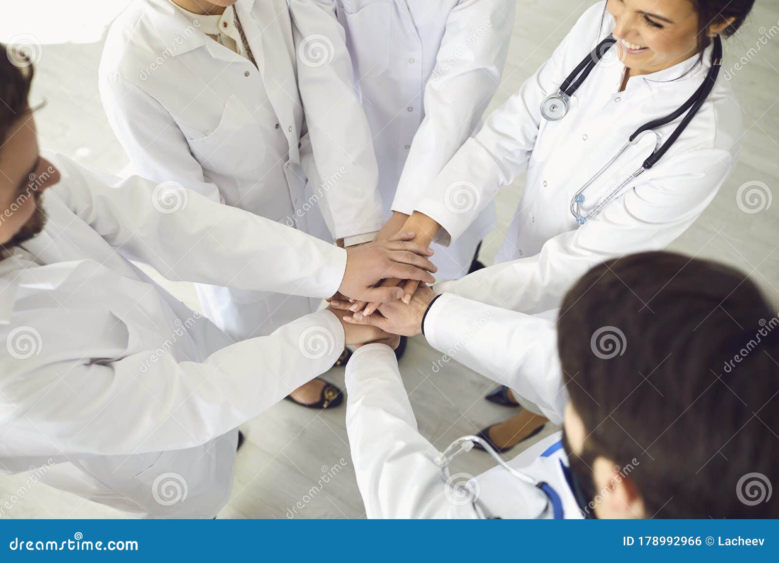 Group of Doctors Joined Hands Together. Medicine Healthcare Clinic ... Group of Doctors Joined Hands Together. Medicine Healthcare Clinic ...
