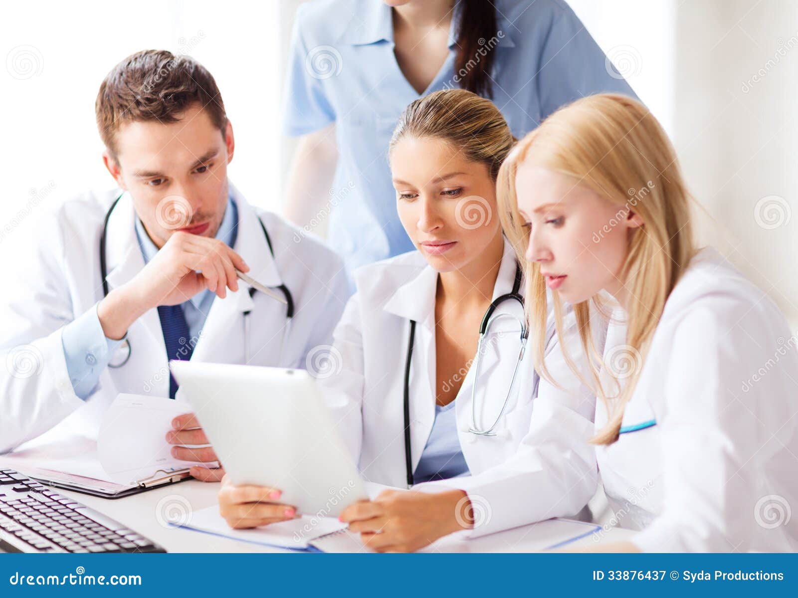 Group of Doctors Looking at Tablet Pc Stock Image - Image of ...
