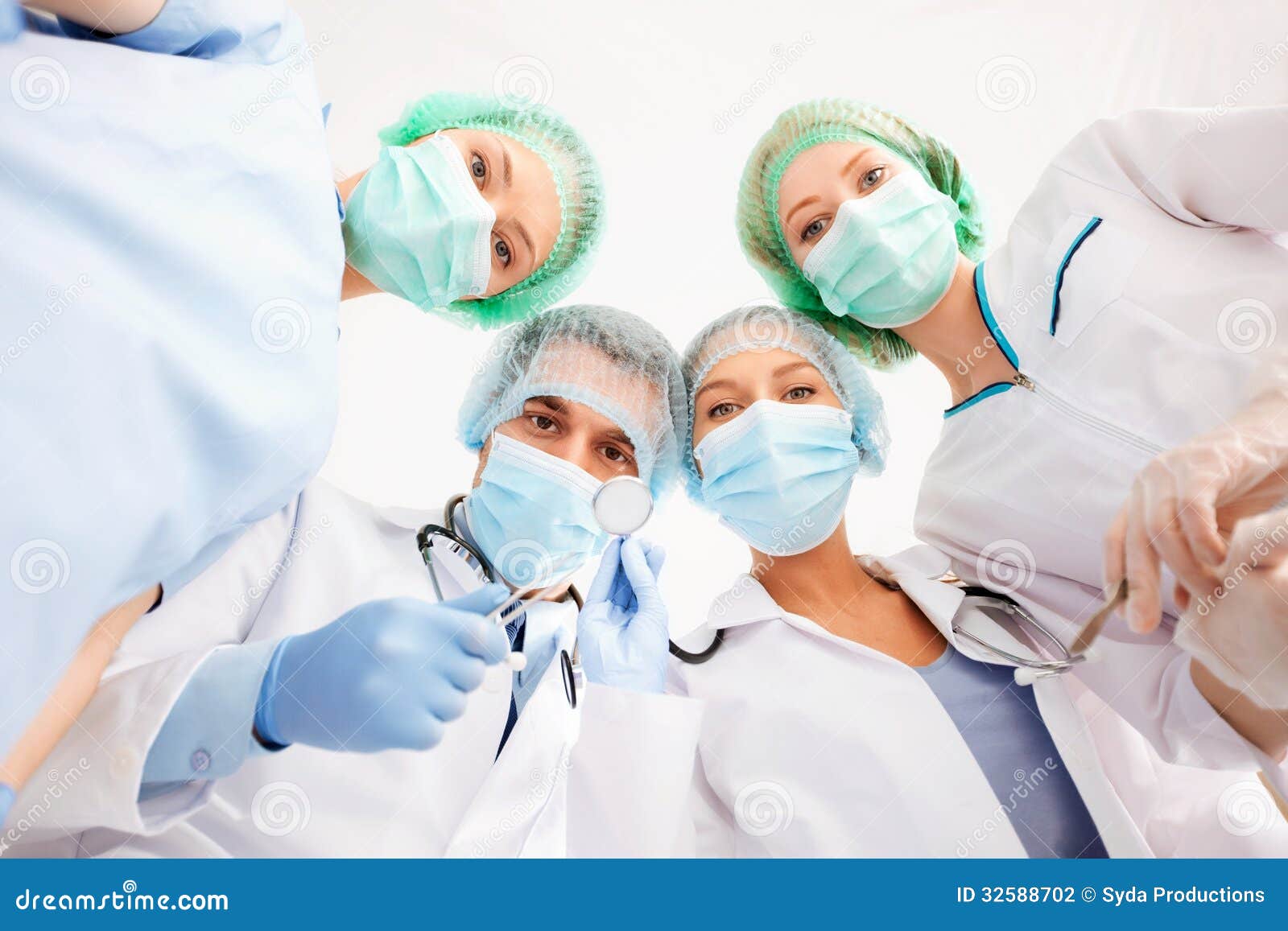 Group Of Doctors In Operating Room Stock Photography - Image: 32588702