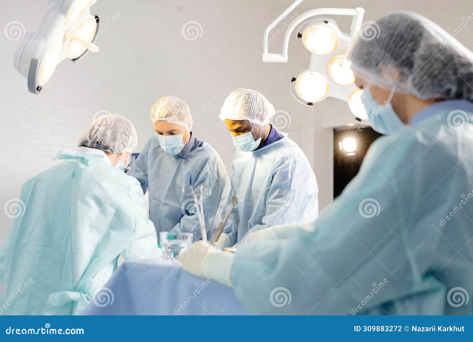 Group of Doctors Performing Surgery in Operating Room Stock Photo ...