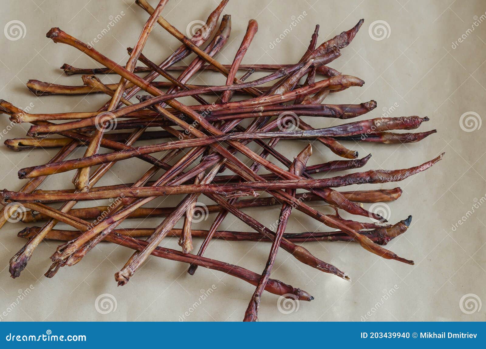 Group of Dried Beef Chewing Sticks Randomly Decomposed on Brown Surface ...