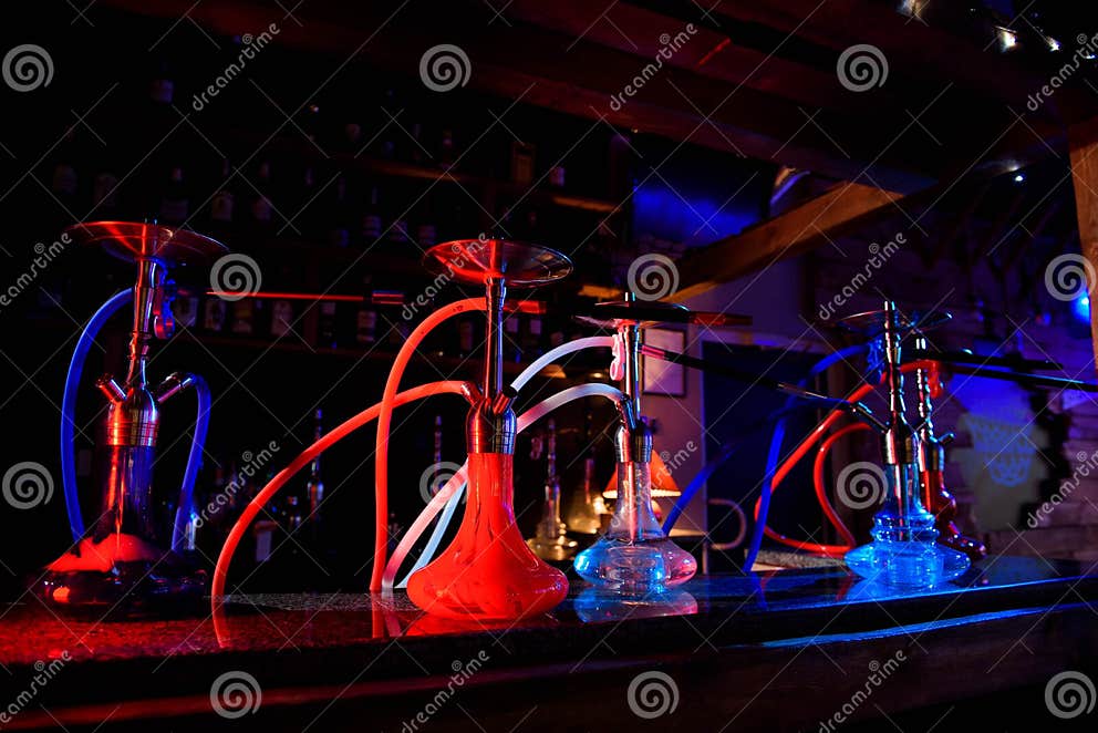 Group of Eastern Hookahs on Table of a Bar. Stock Photo - Image of tube ...