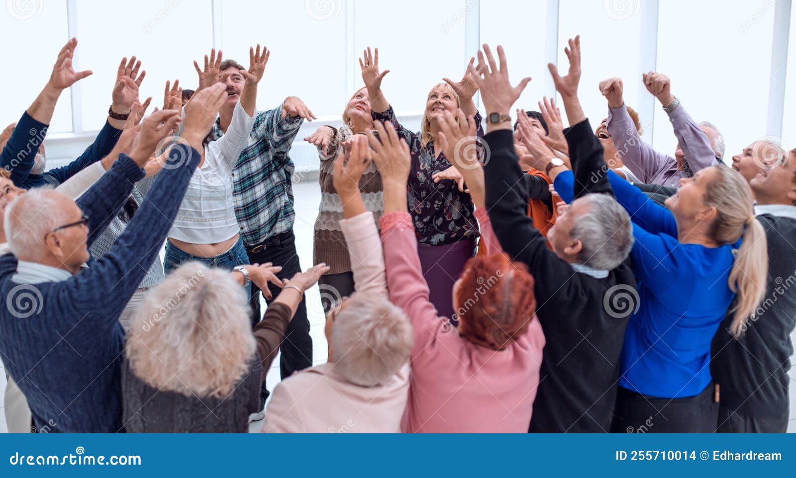 A Group of Elderly People are Reaching Up Stock Photo - Image of team ...
