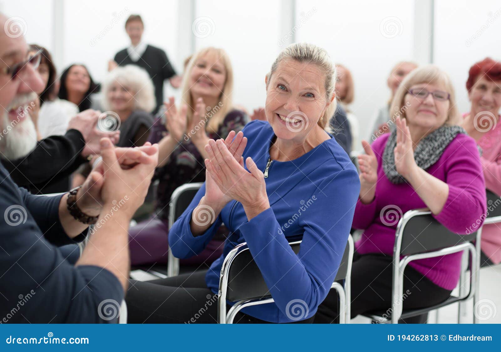 A Group of Elderly People are Sitting in a Circle Clapping Their Stock ...