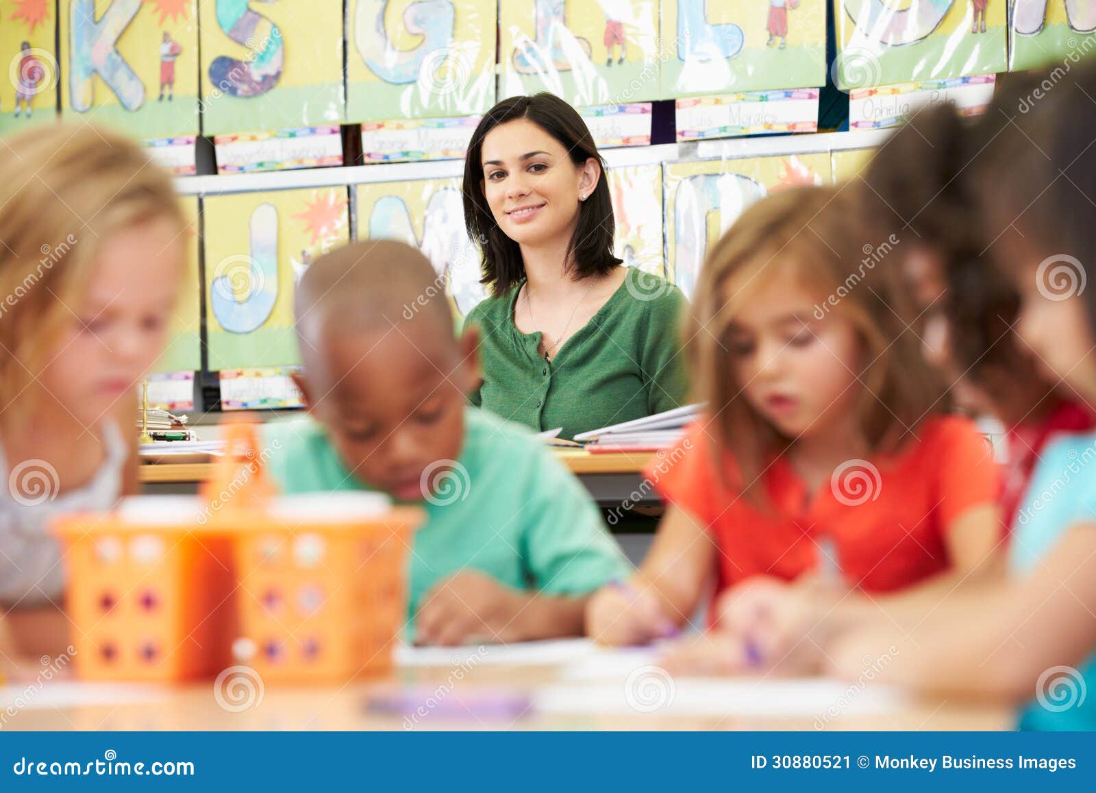 Group Of Elementary Age Children In Art Class With Teacher Royalty-Free ...
