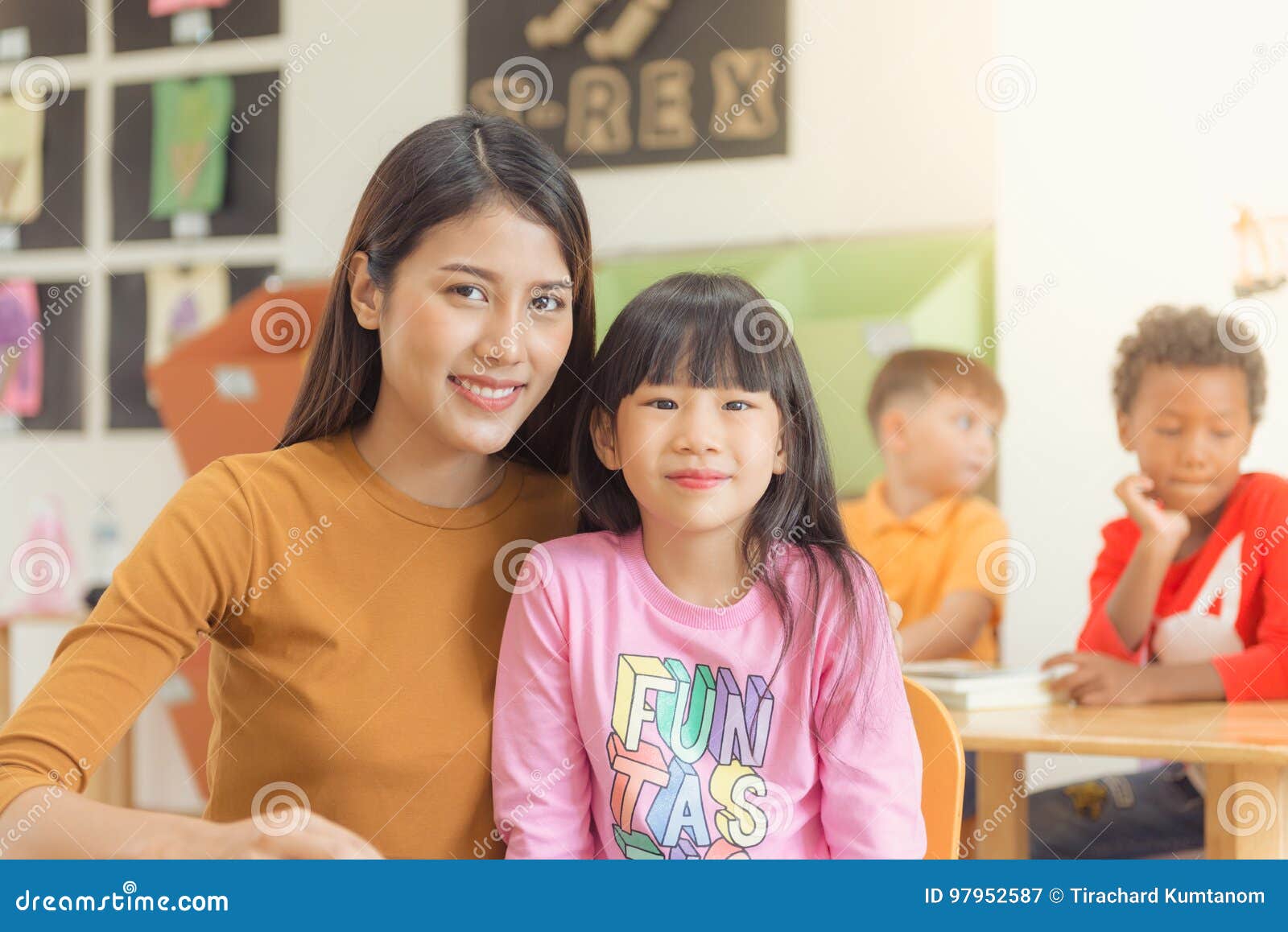 Group of Elementary Age Children in Class with Teacher Learning and ...