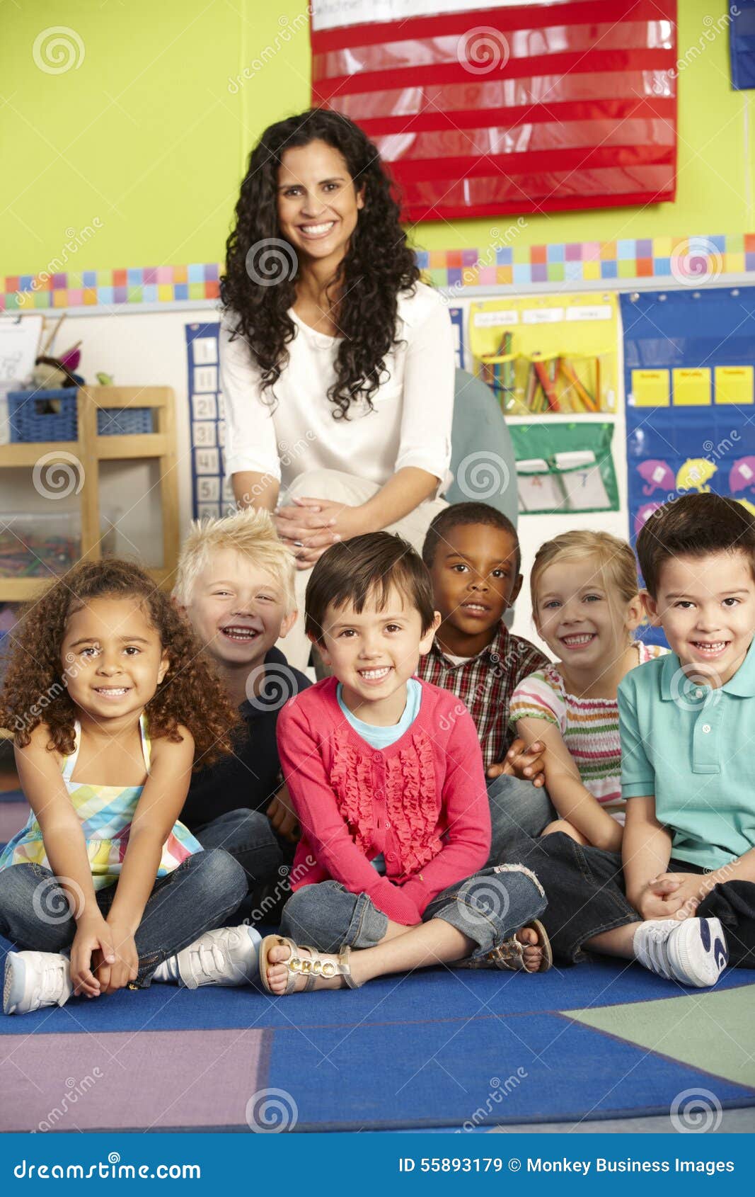 Group of Elementary Age Schoolchildren in Class with Teacher Stock ...