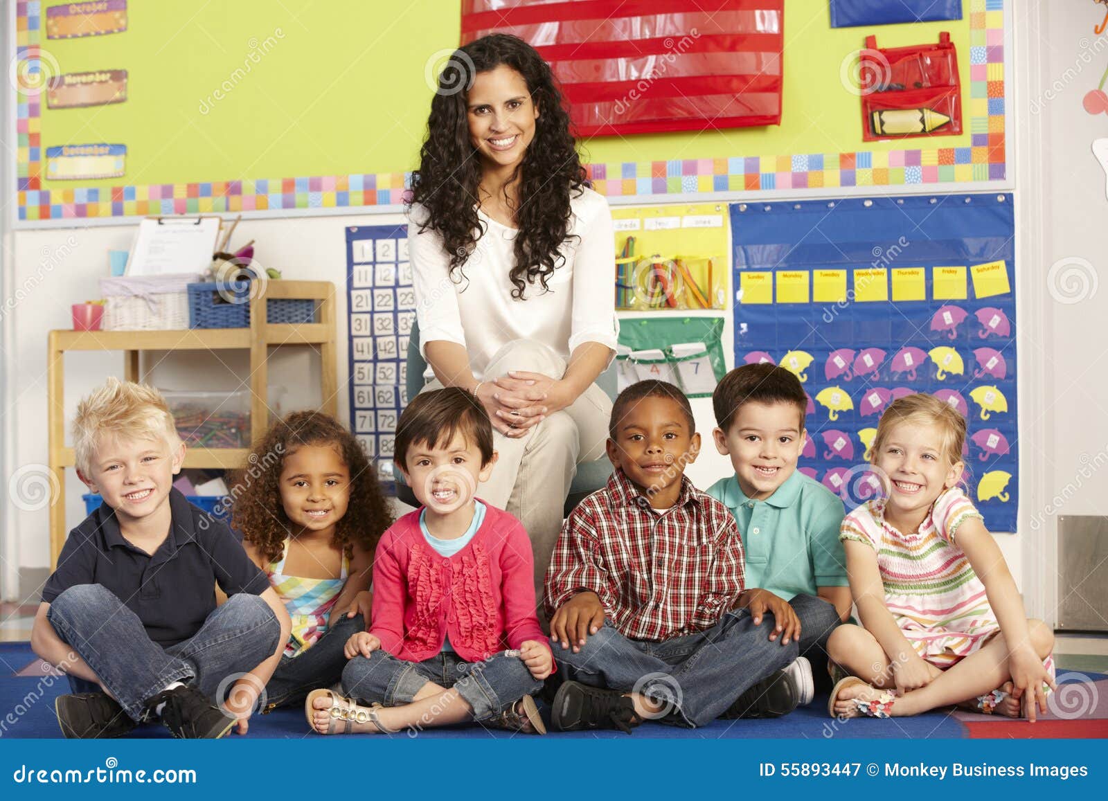 Group of Elementary Age Schoolchildren in Class with Teacher Stock ...