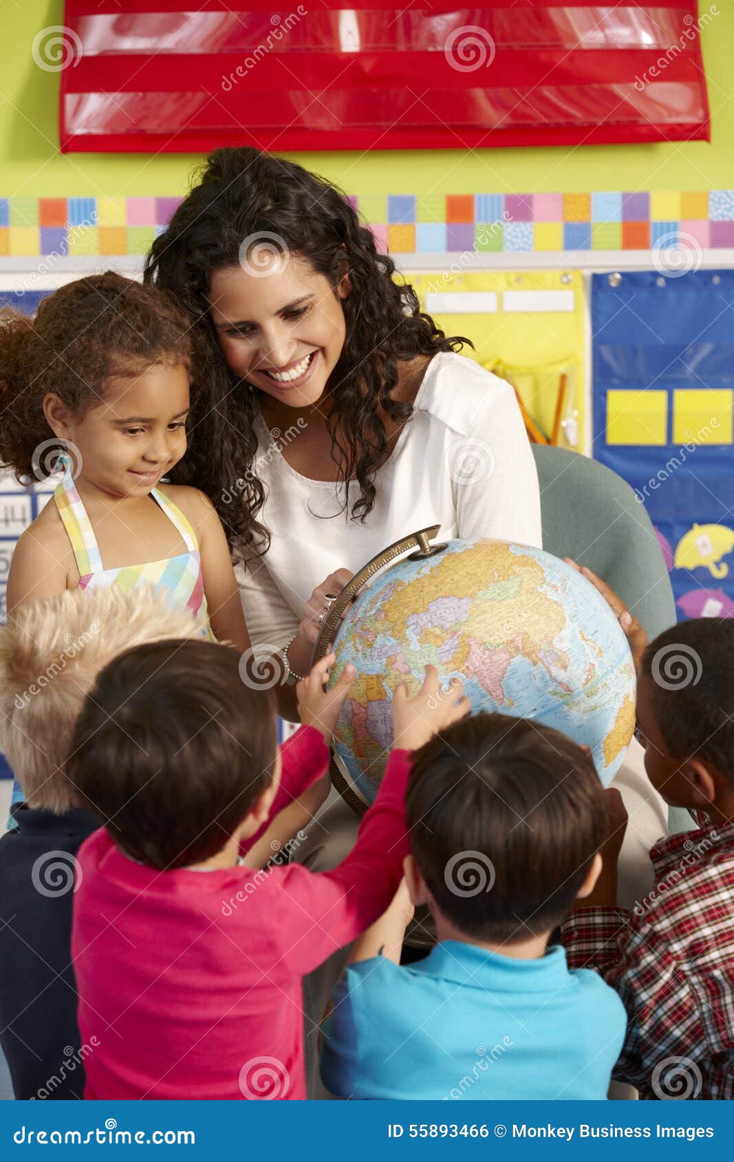 Group of Elementary Age Schoolchildren in Class with Teacher Stock ...