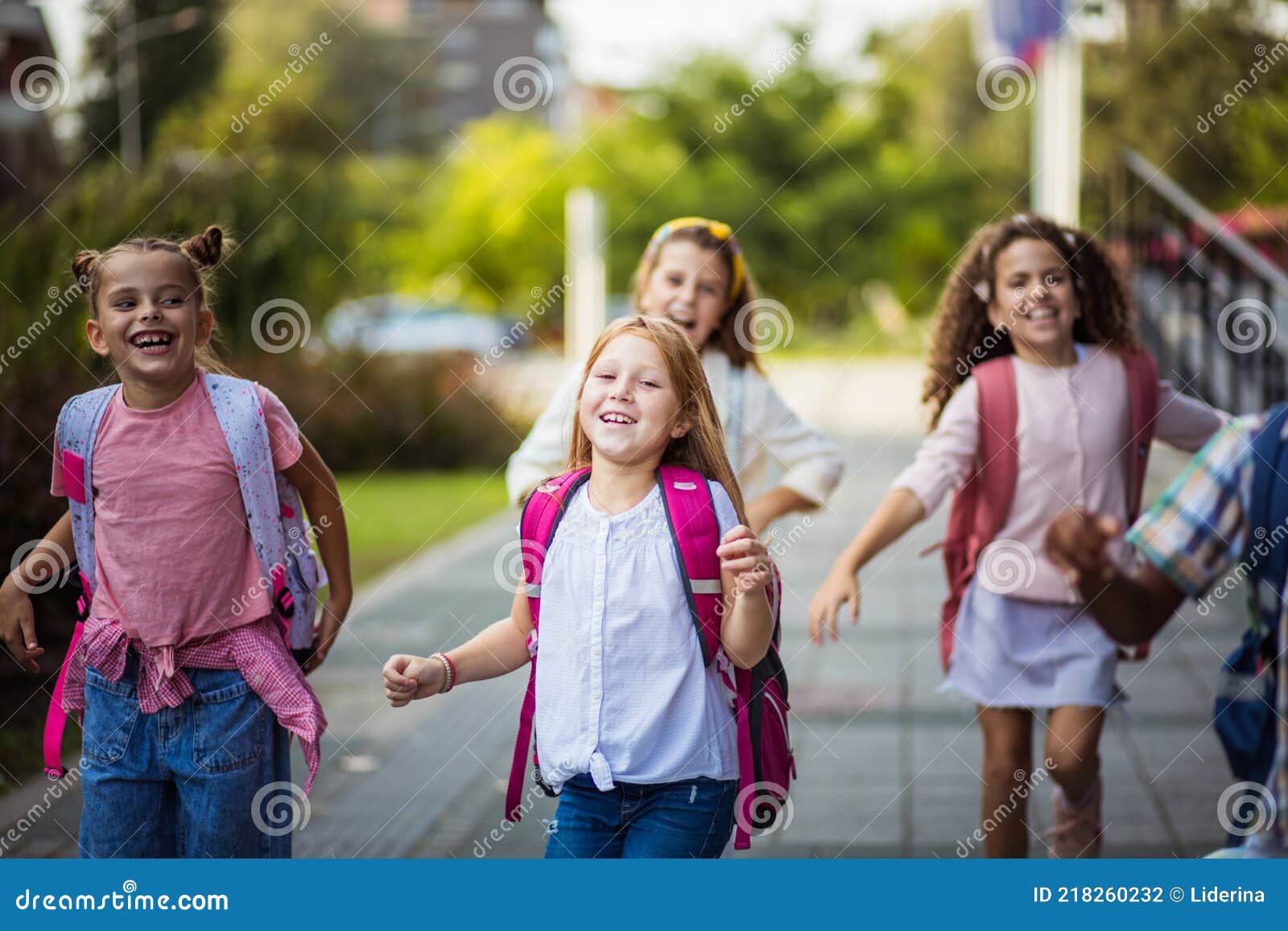A Group Of Elementary School Kids Rushing Out Of School Royalty-Free ...