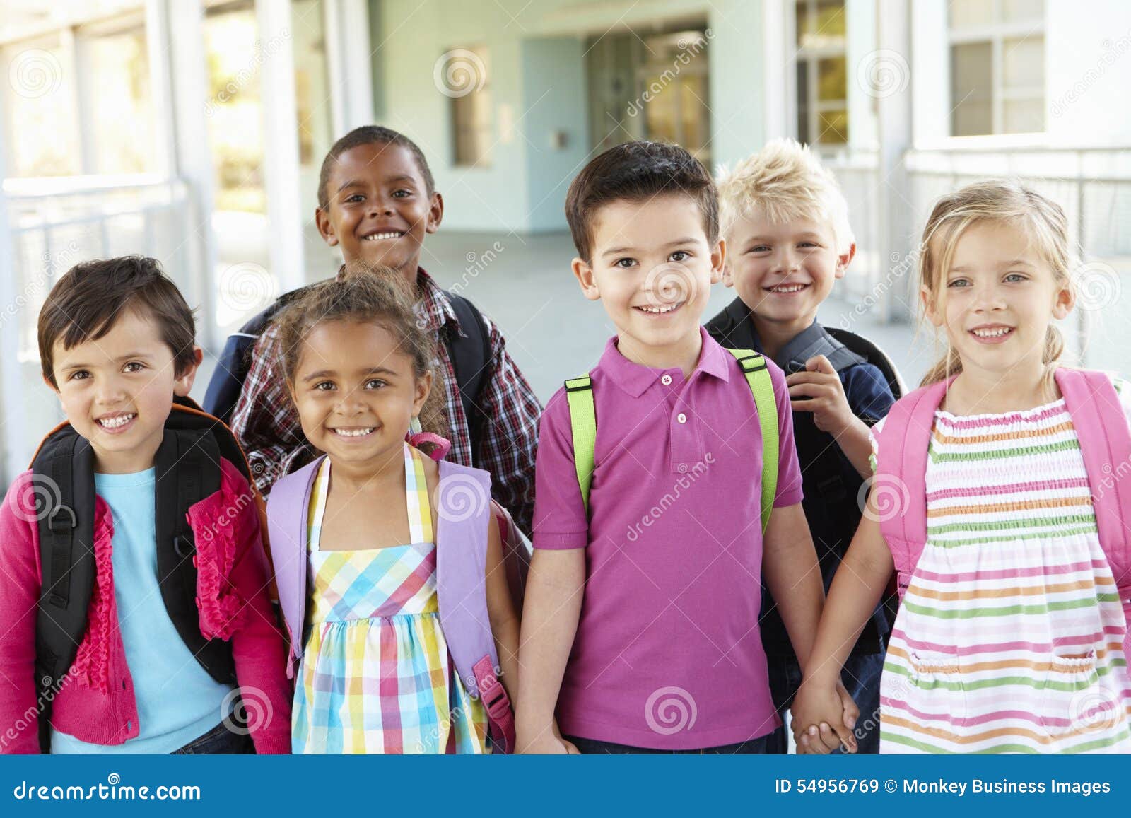 Group of Elementary Age Schoolchildren Standing Outside Stock Image ...