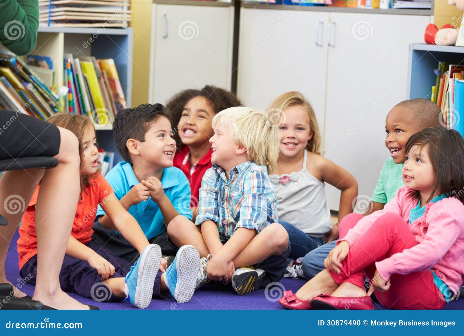 Group of Elementary Pupils in Classroom Listening To Teacher Stock ...