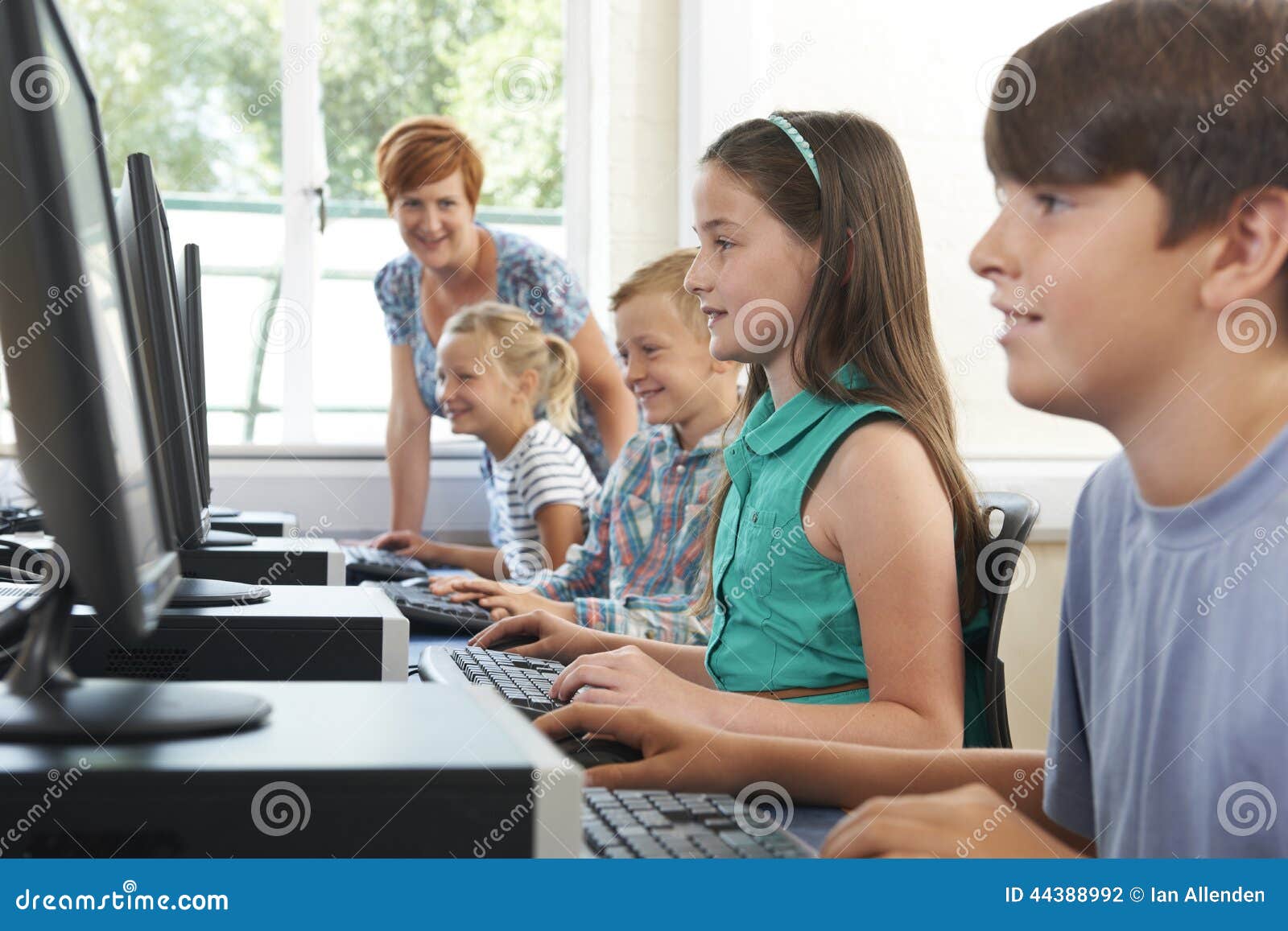 Elementary Pupils Counting With Teacher In Classroom Royalty-Free Stock ...