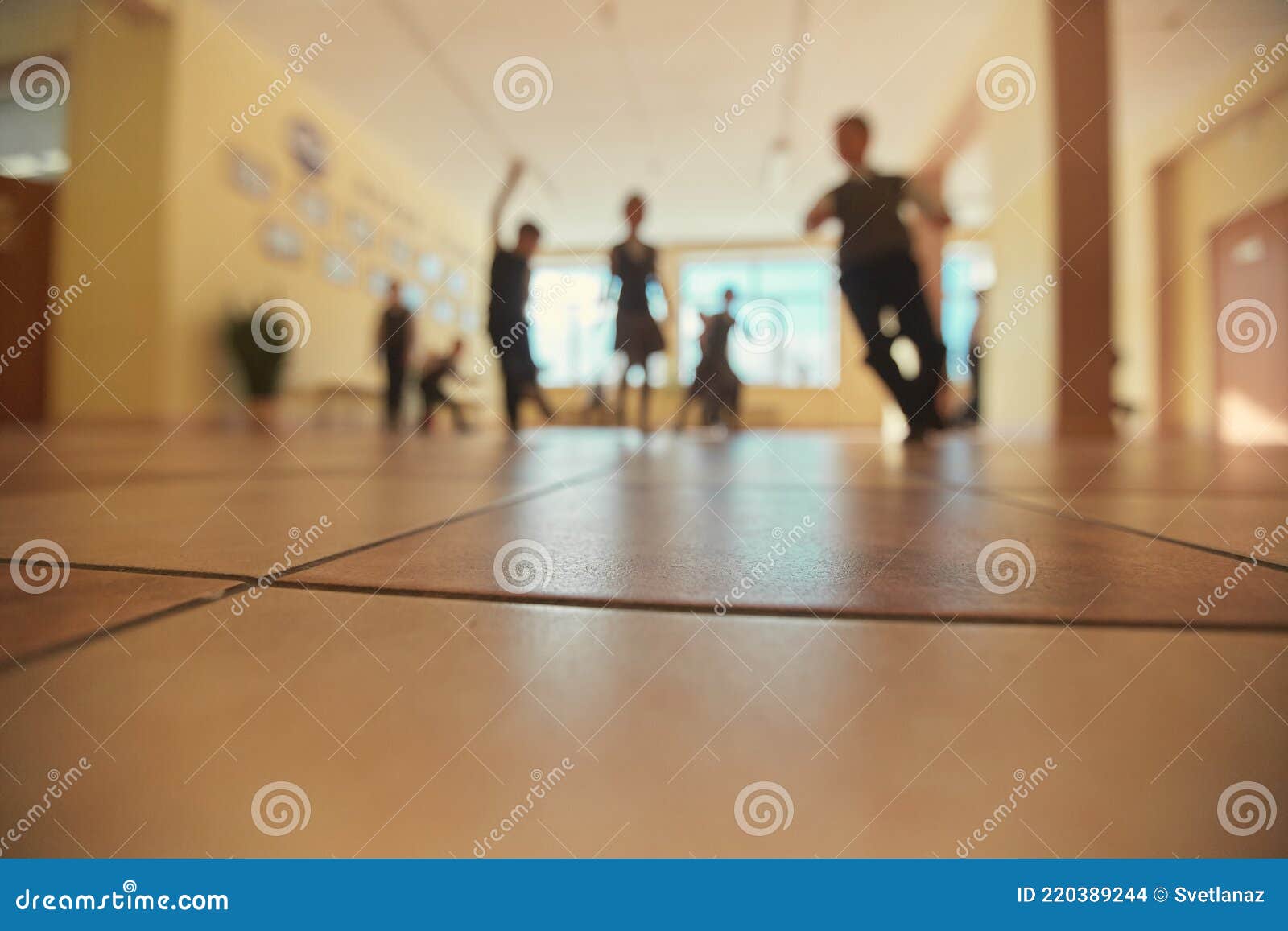 A Group of Elementary School Children Running Around the School ...