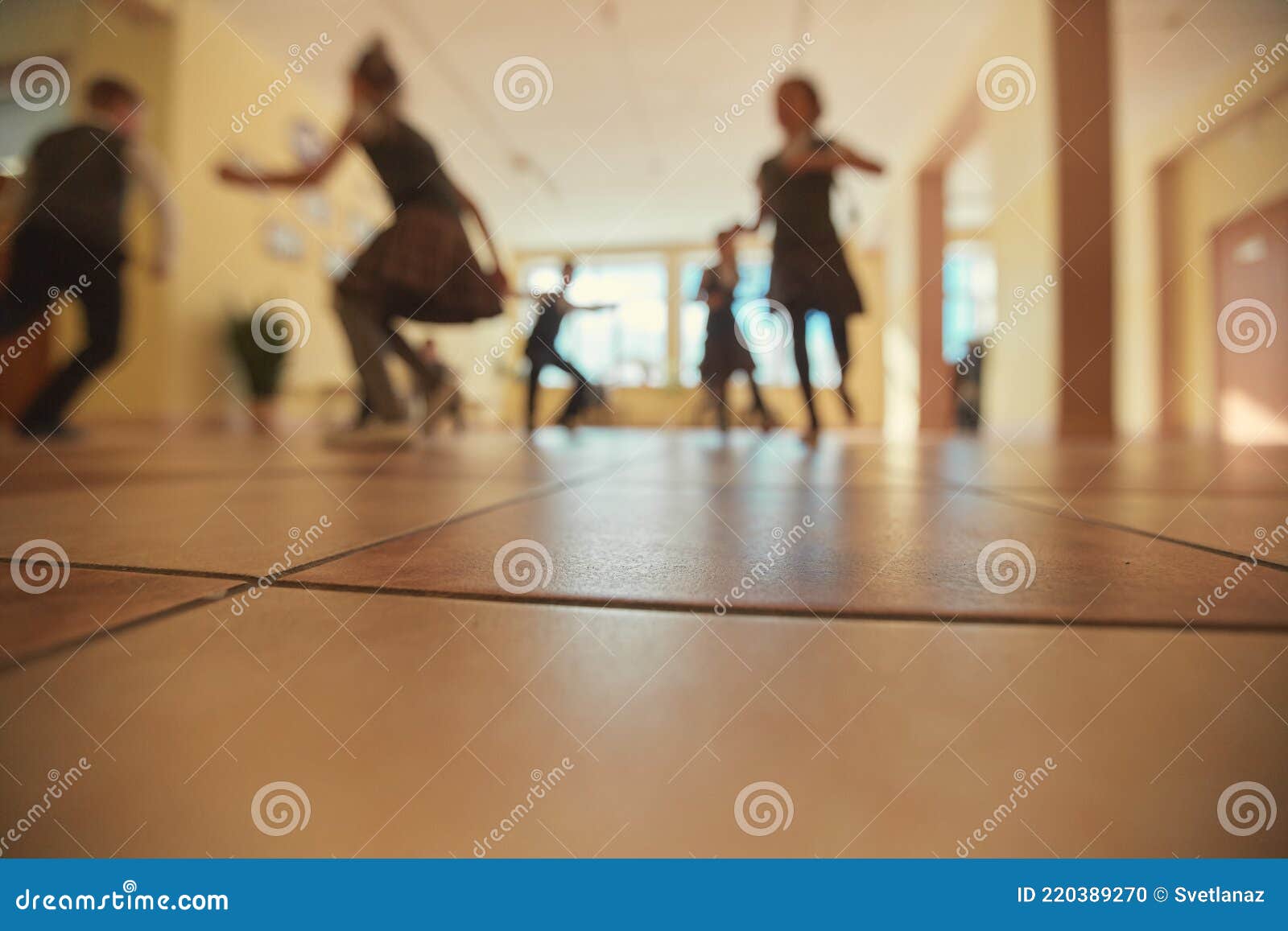 A Group of Elementary School Children Running Around the School ...