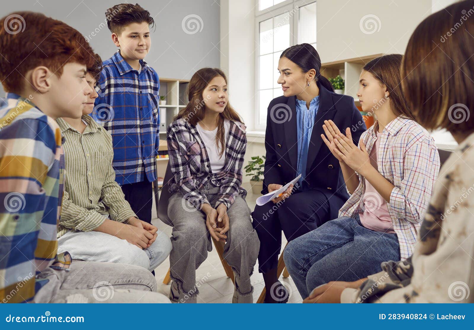 Group of Elementary School Children Sitting in Circle during Class ...