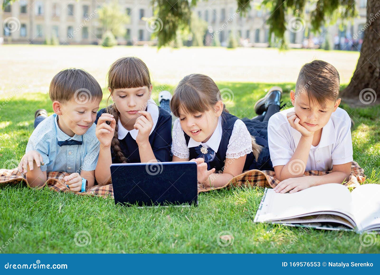 Group of Elementary School Children Working Together on Nature at Park ...